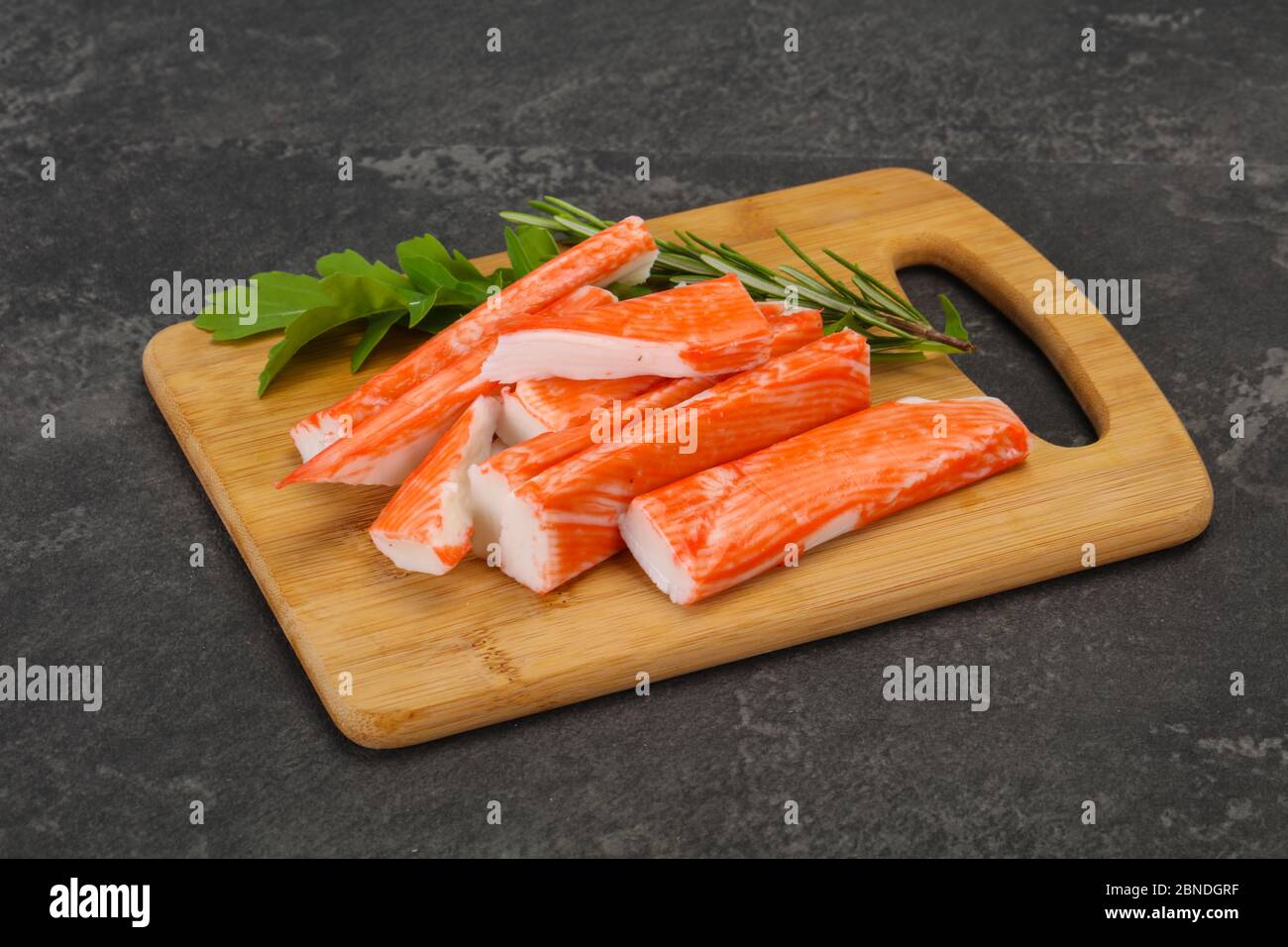 Crab stick surimi over wooden board Stock Photo - Alamy