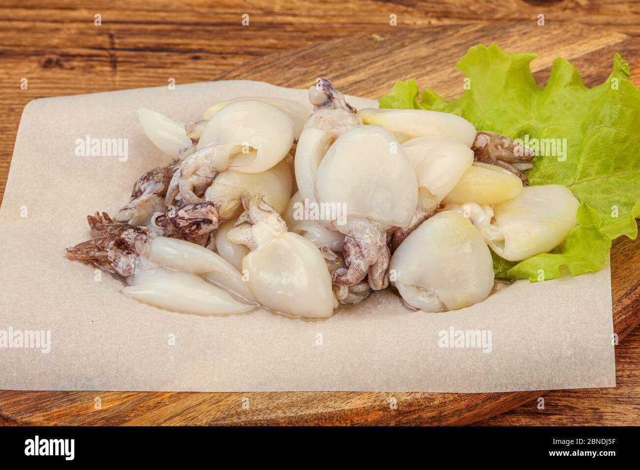Raw seafood - cuttlefish for cooking over board Stock Photo - Alamy