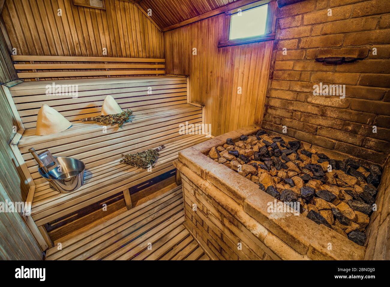 Beautiful sauna room design with a wooden bench and sauna rocks Stock ...