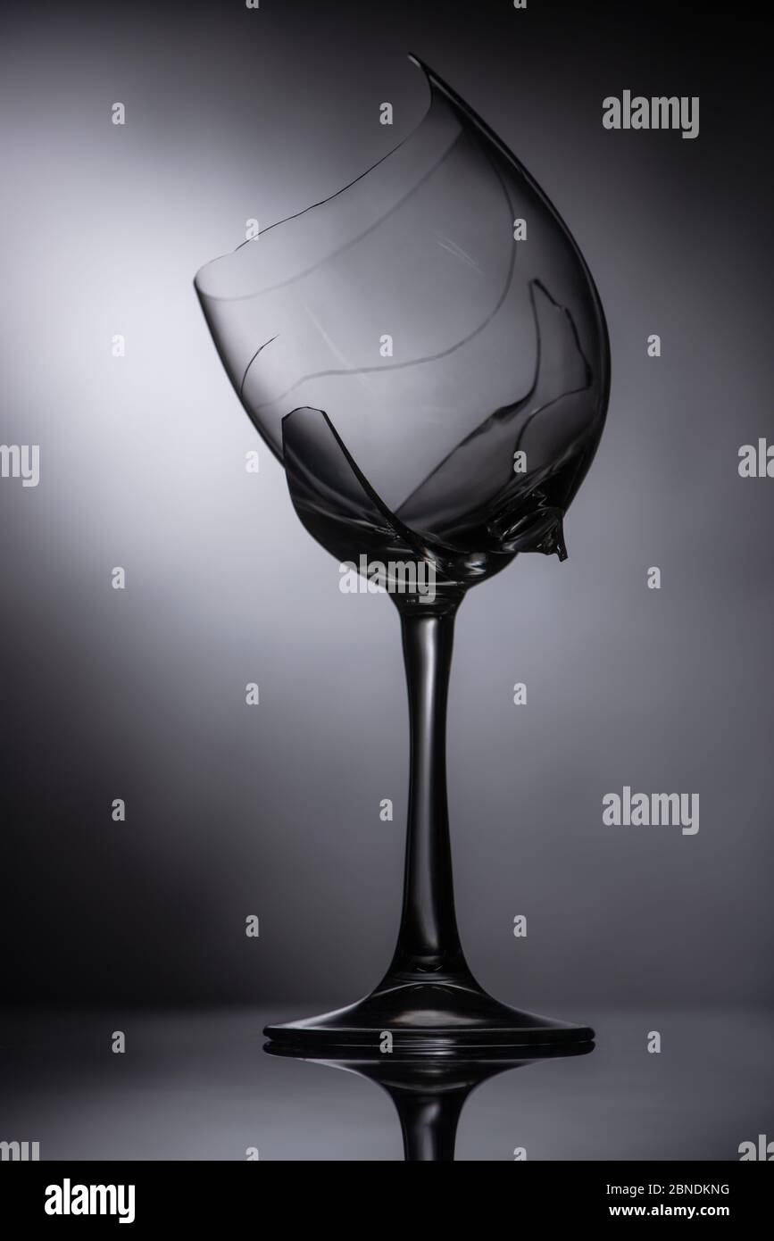 broken sharp glass on dark black background Stock Photo - Alamy