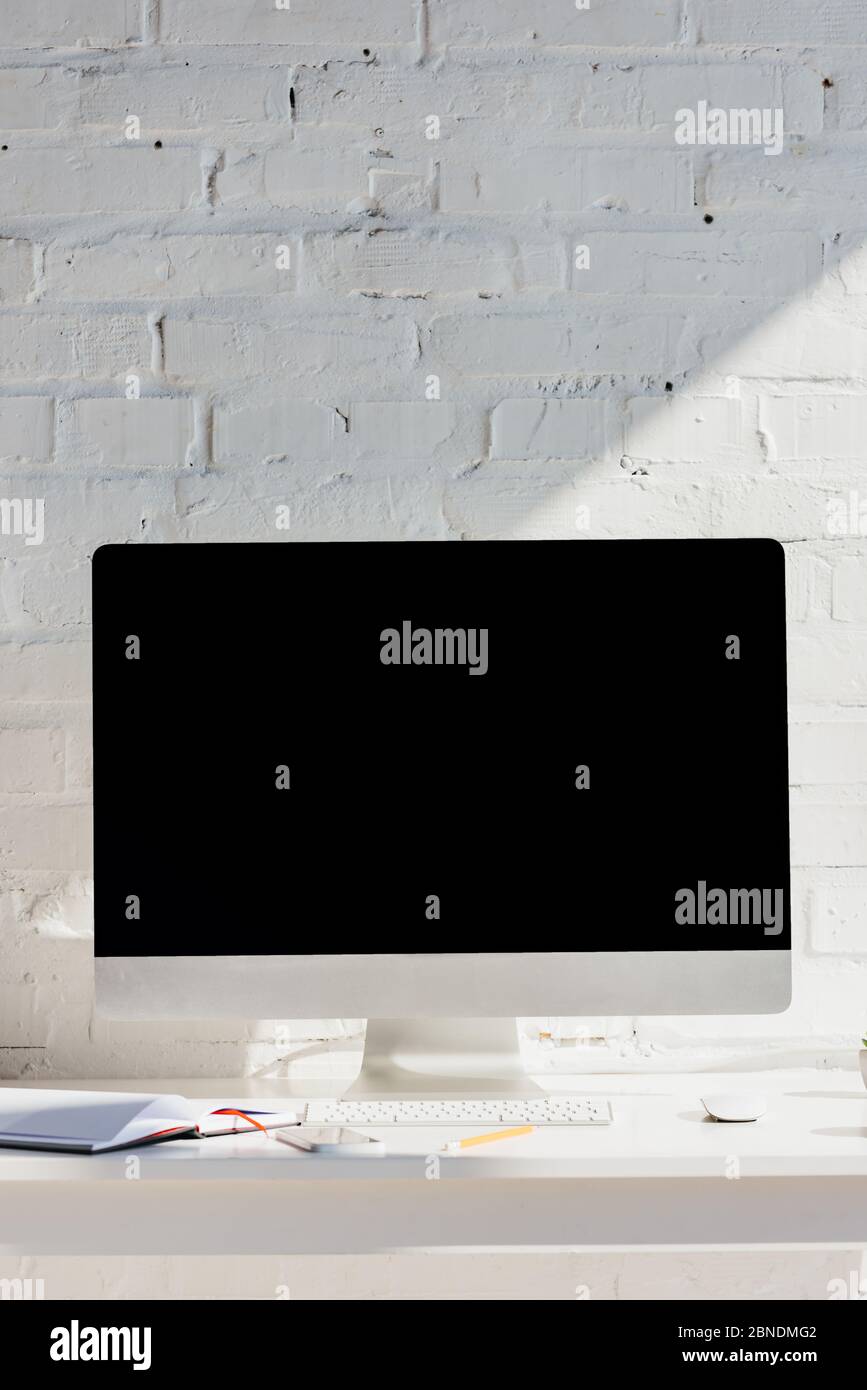 home office with computer monitor with blank screen in sunlight Stock ...
