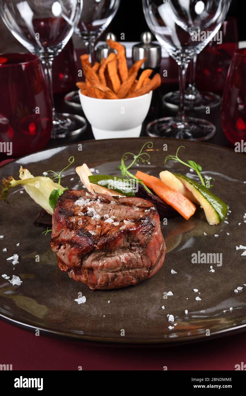 Rib eye steak, seasonal vegetables and sweet potatoes Fries in the ...