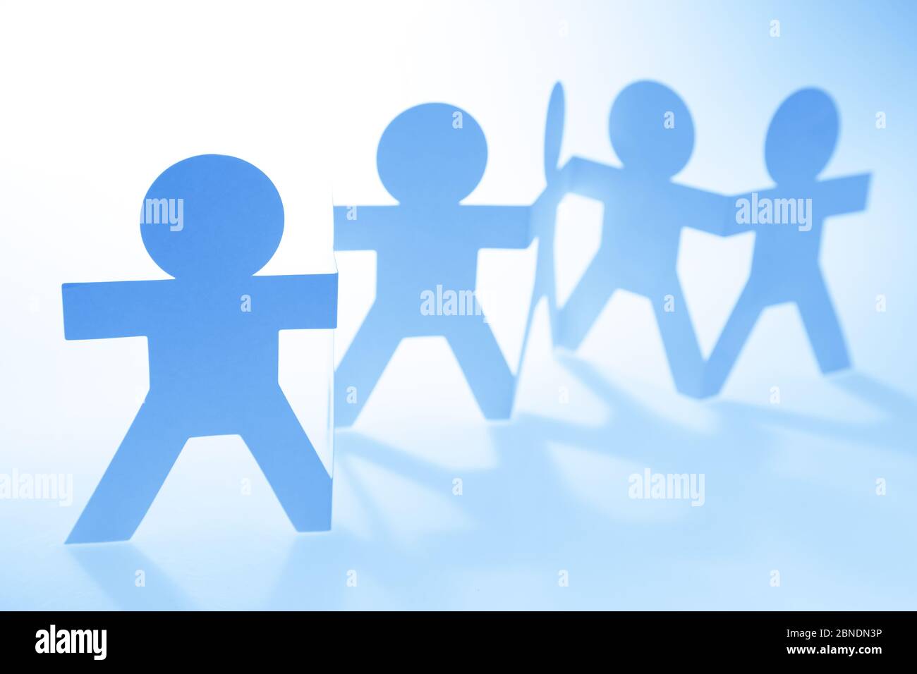 Team of paper chain people Stock Photo - Alamy