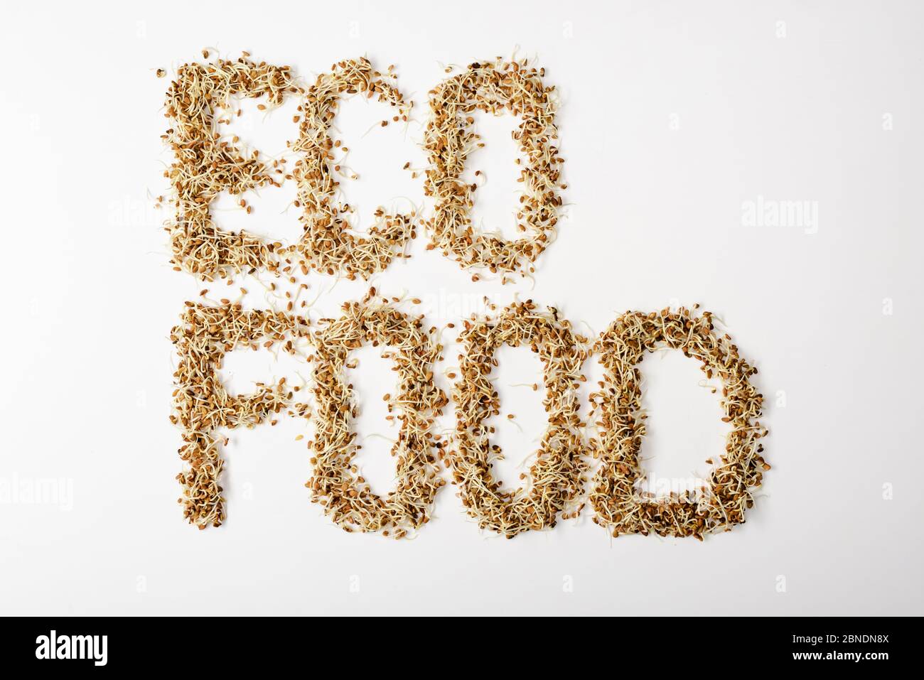 top view of eco food lettering made of sprouts on white background ...