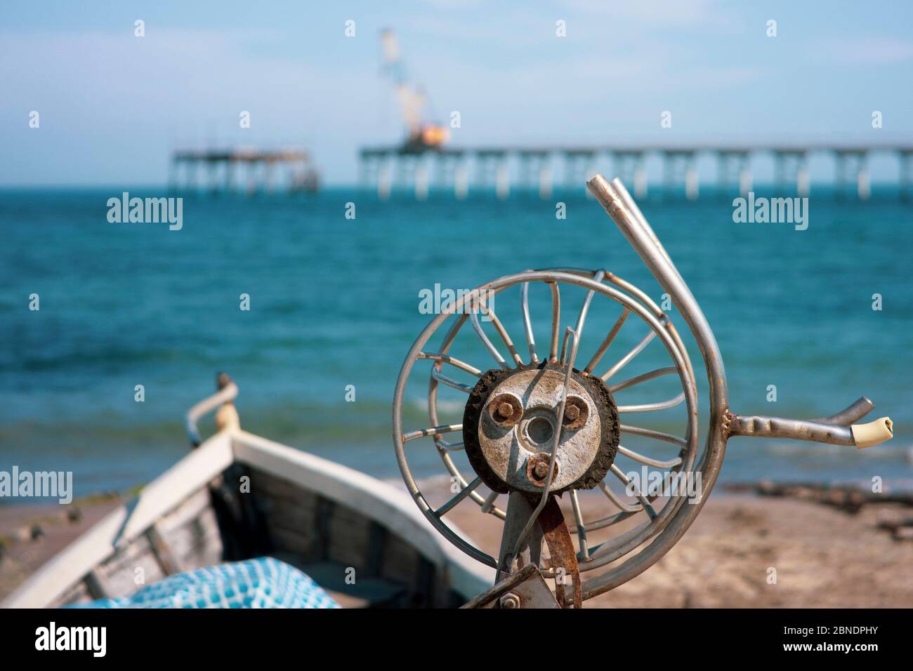 Boat with mussels and oyster container with a fishing pier Stock Photo ...
