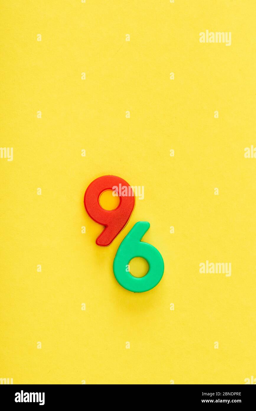 Top view of six and nine numbers on yellow background Stock Photo - Alamy