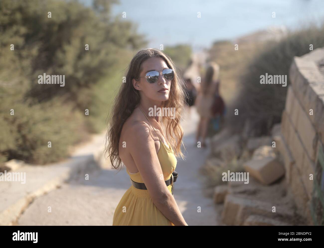 Young girl on a vacation with friends on a sunny day Stock Photo - Alamy