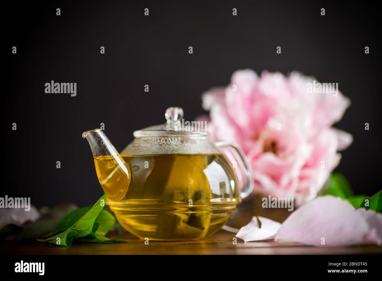 summer flower tea from rose petals in a glass teapot Stock Photo - Alamy