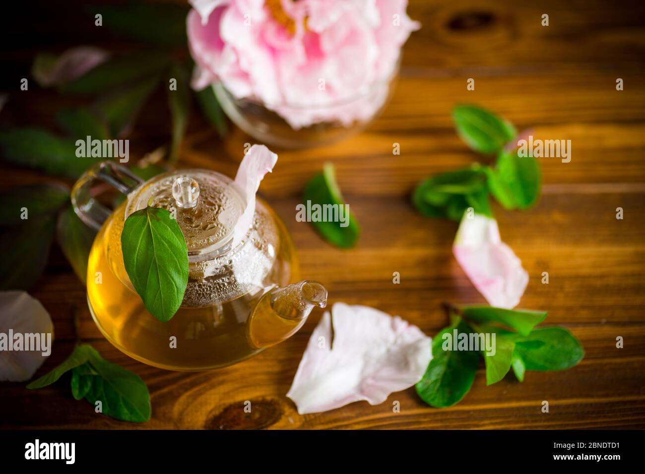 summer flower tea from rose petals in a glass teapot Stock Photo - Alamy