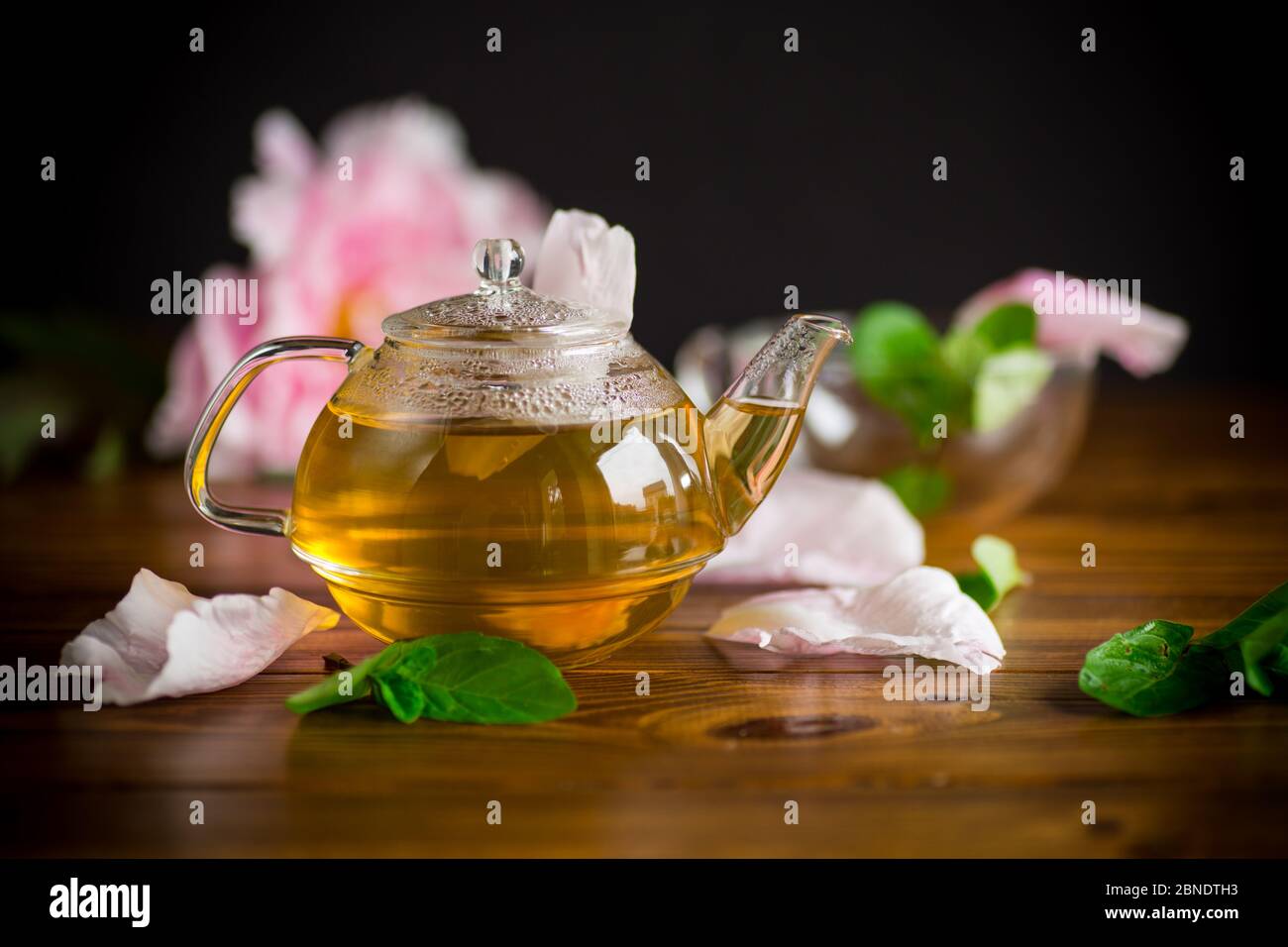 summer flower tea from rose petals in a glass teapot Stock Photo - Alamy