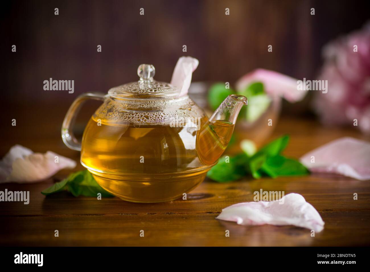 summer flower tea from rose petals in a glass teapot Stock Photo - Alamy