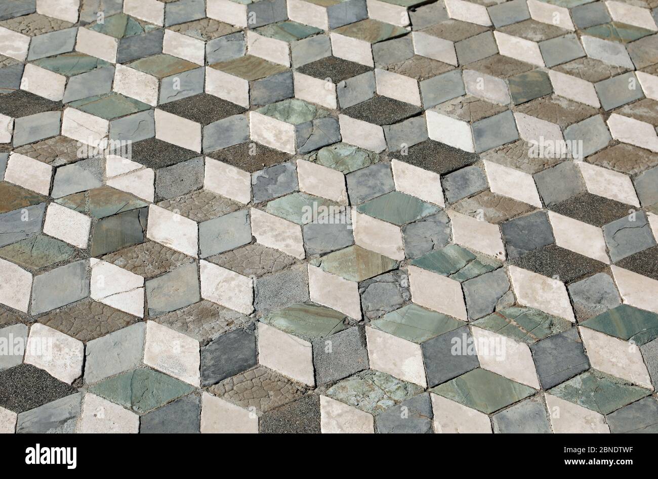 tiled old floor with tiles that create an optical effect of ...