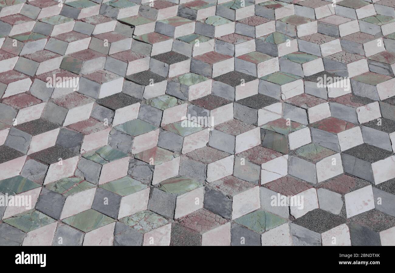 strange floor with tiles that create an optical effect of cubes ...