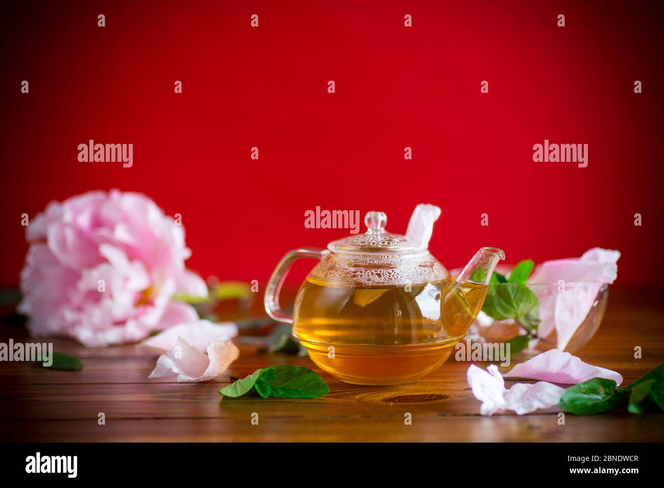 summer flower tea from rose petals in a glass teapot Stock Photo - Alamy