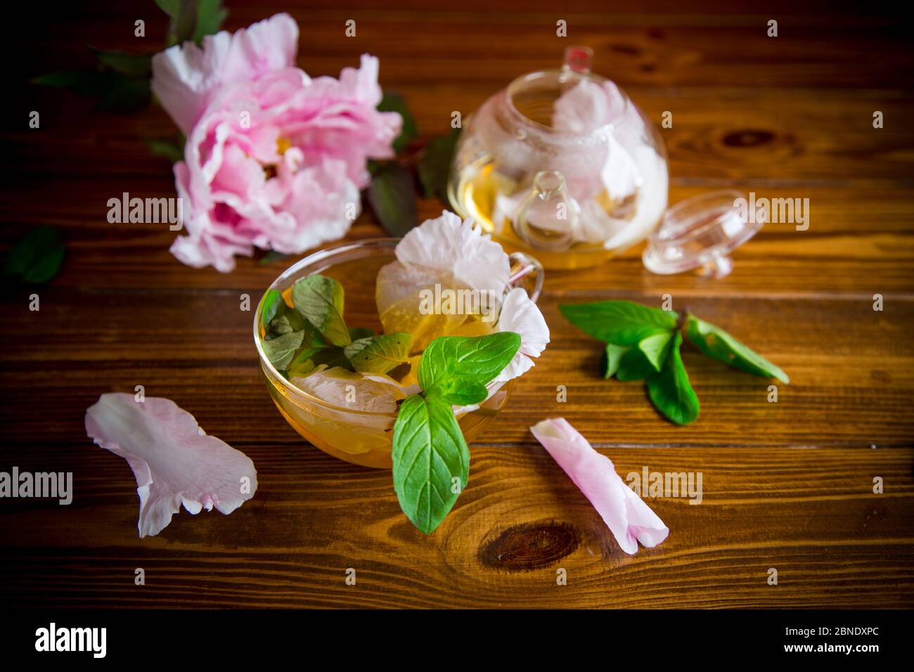 summer flower tea from rose petals in a glass teapot Stock Photo - Alamy