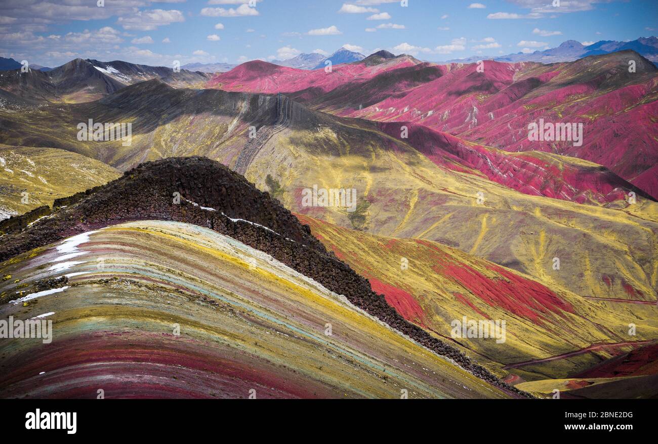 Aerial view of mountains and rock formations of different colors ...