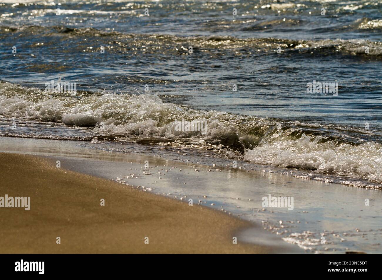 waves splashing at the beach Stock Photo - Alamy