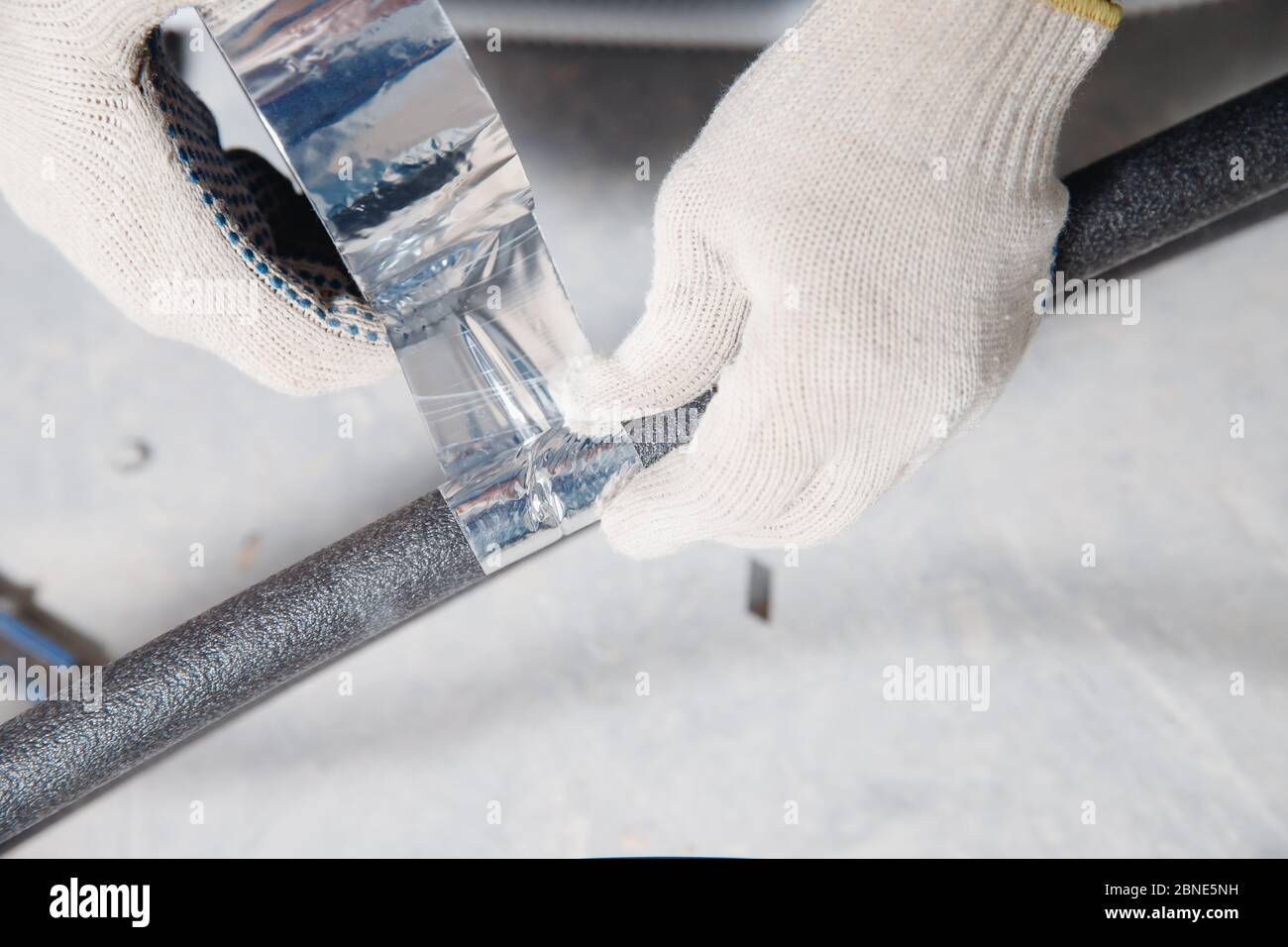 Worker man Installation of pipe channel for connecting air conditioner ...