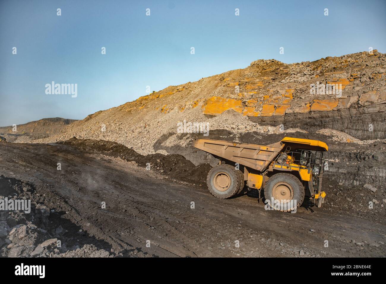Big yellow mining truck empty body for anthracite. Open pit mine ...