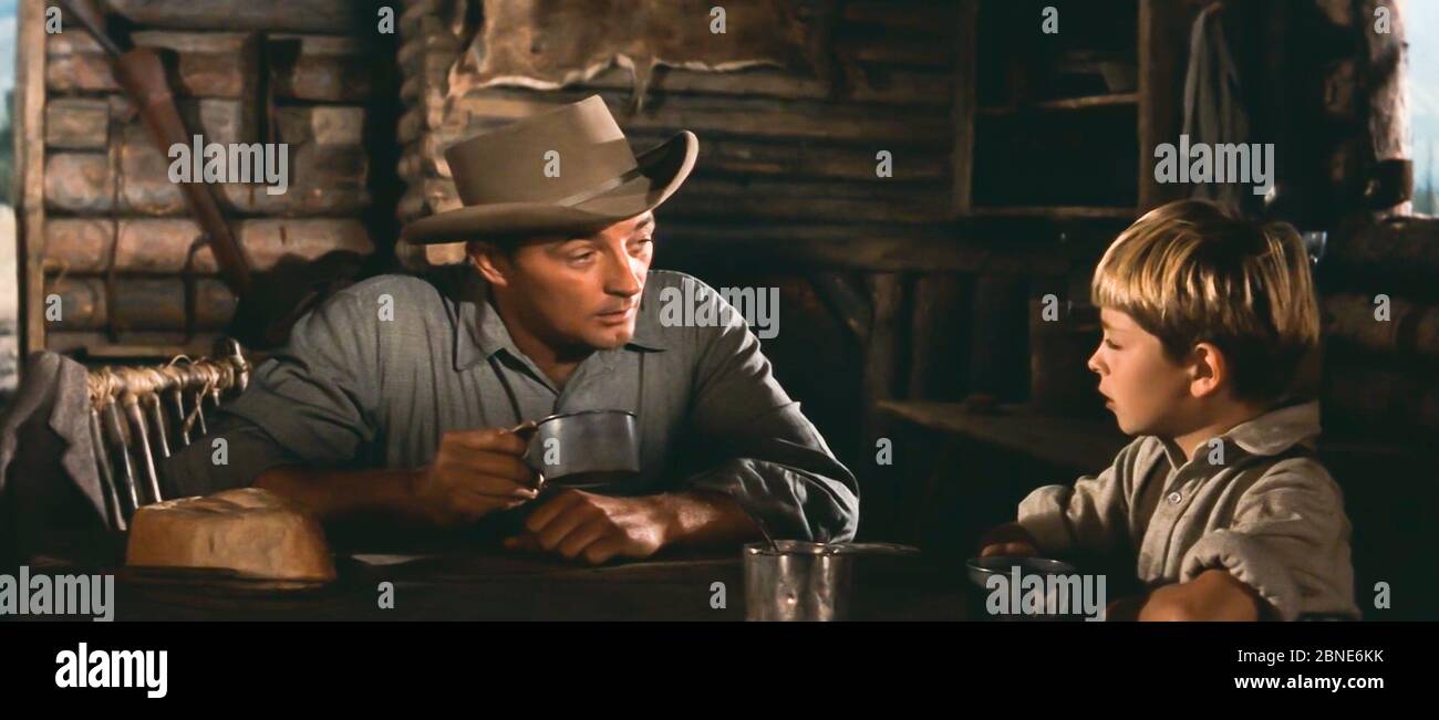 USA. Robert Mitchum and Tommy Rettig in ©Twentieth Century Fox film ...