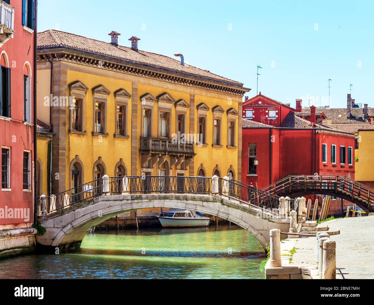 Tourist view of Venice. Channels with reflections. Street lights and ...