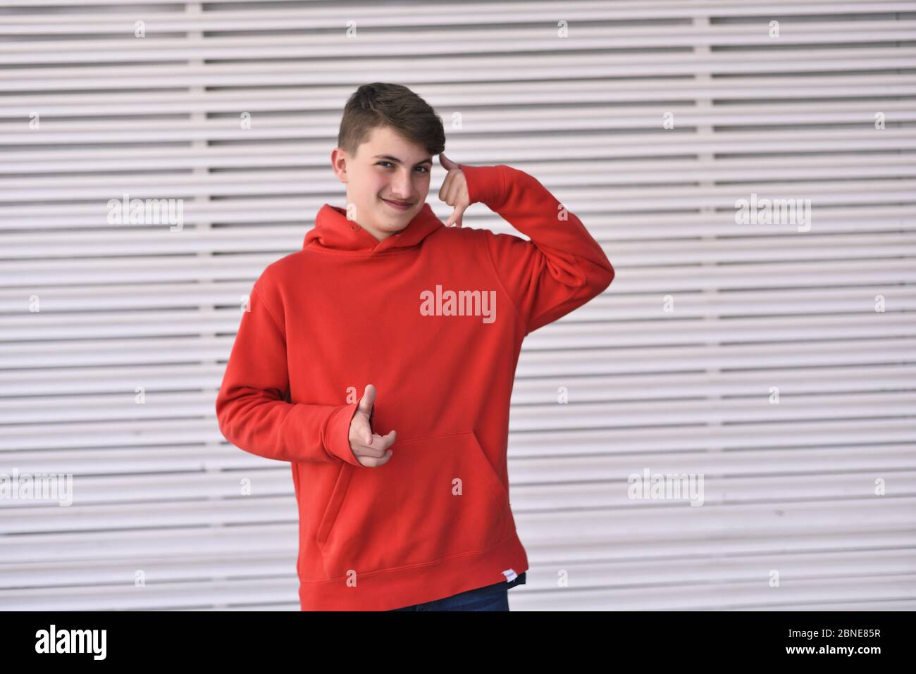 portrait of smiley teenager. dressing in a red shirt Stock Photo - Alamy