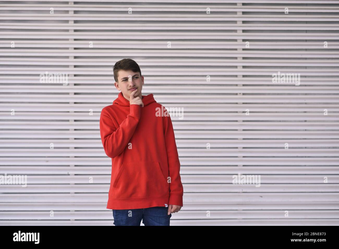 portrait of smiley teenager. dressing in a red shirt Stock Photo - Alamy