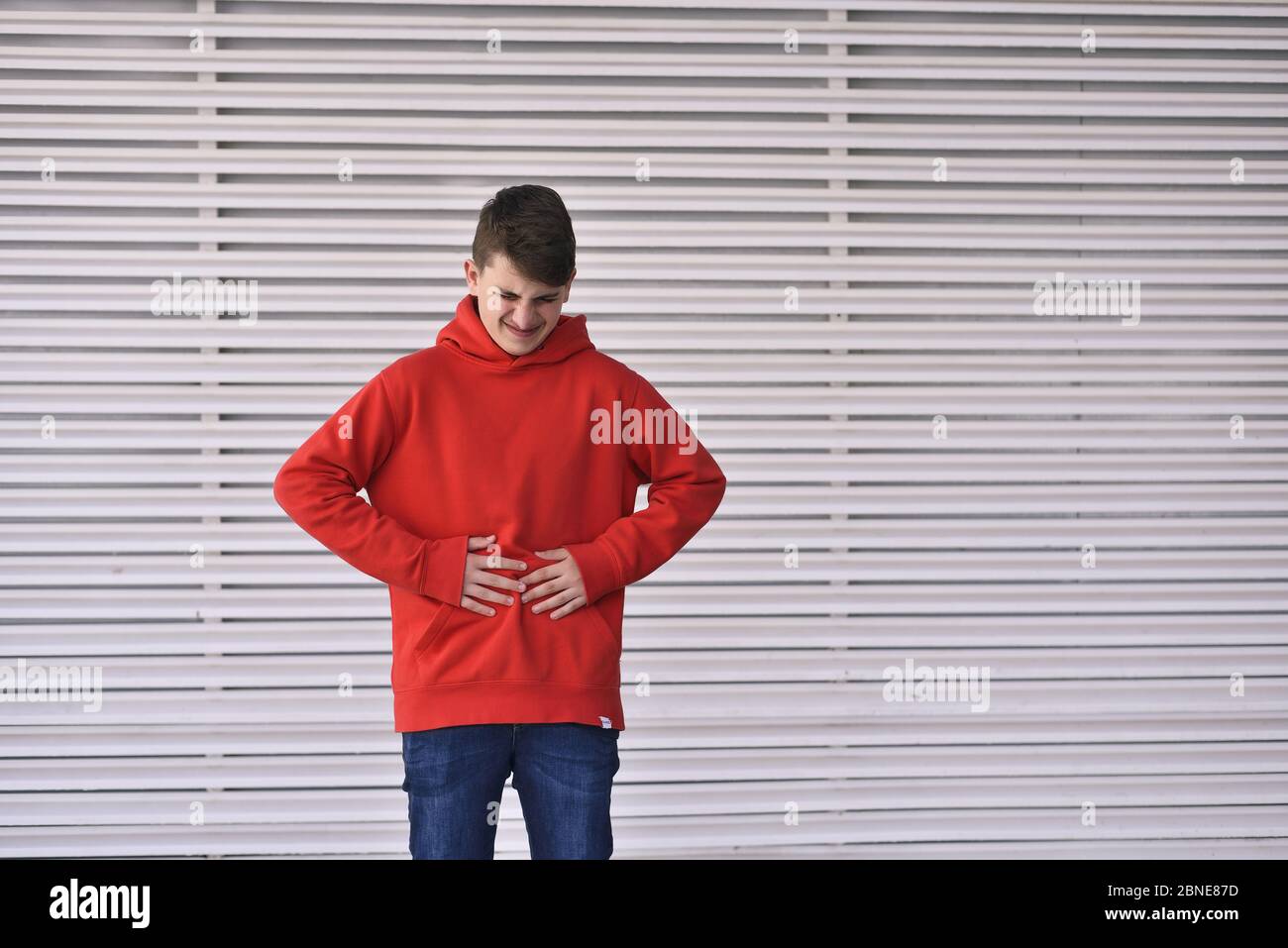 portrait of smiley teenager. dressing in a red shirt Stock Photo - Alamy