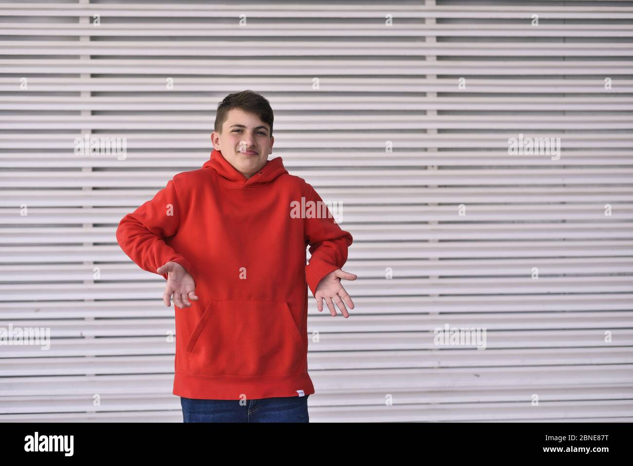 portrait of smiley teenager. dressing in a red shirt Stock Photo - Alamy
