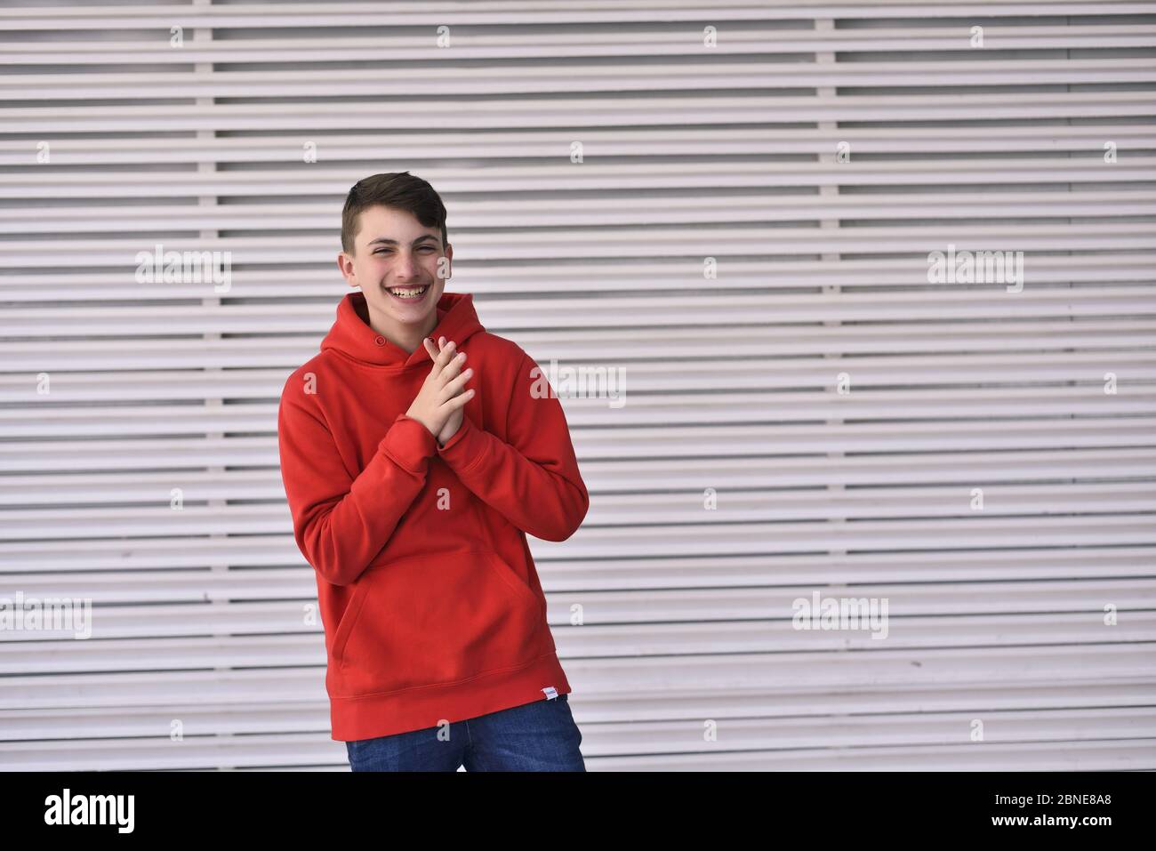 portrait of smiley teenager. dressing in a red shirt Stock Photo - Alamy
