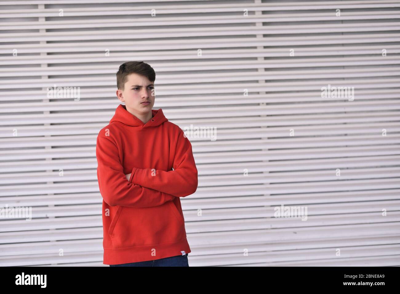 portrait of smiley teenager. dressing in a red shirt Stock Photo - Alamy