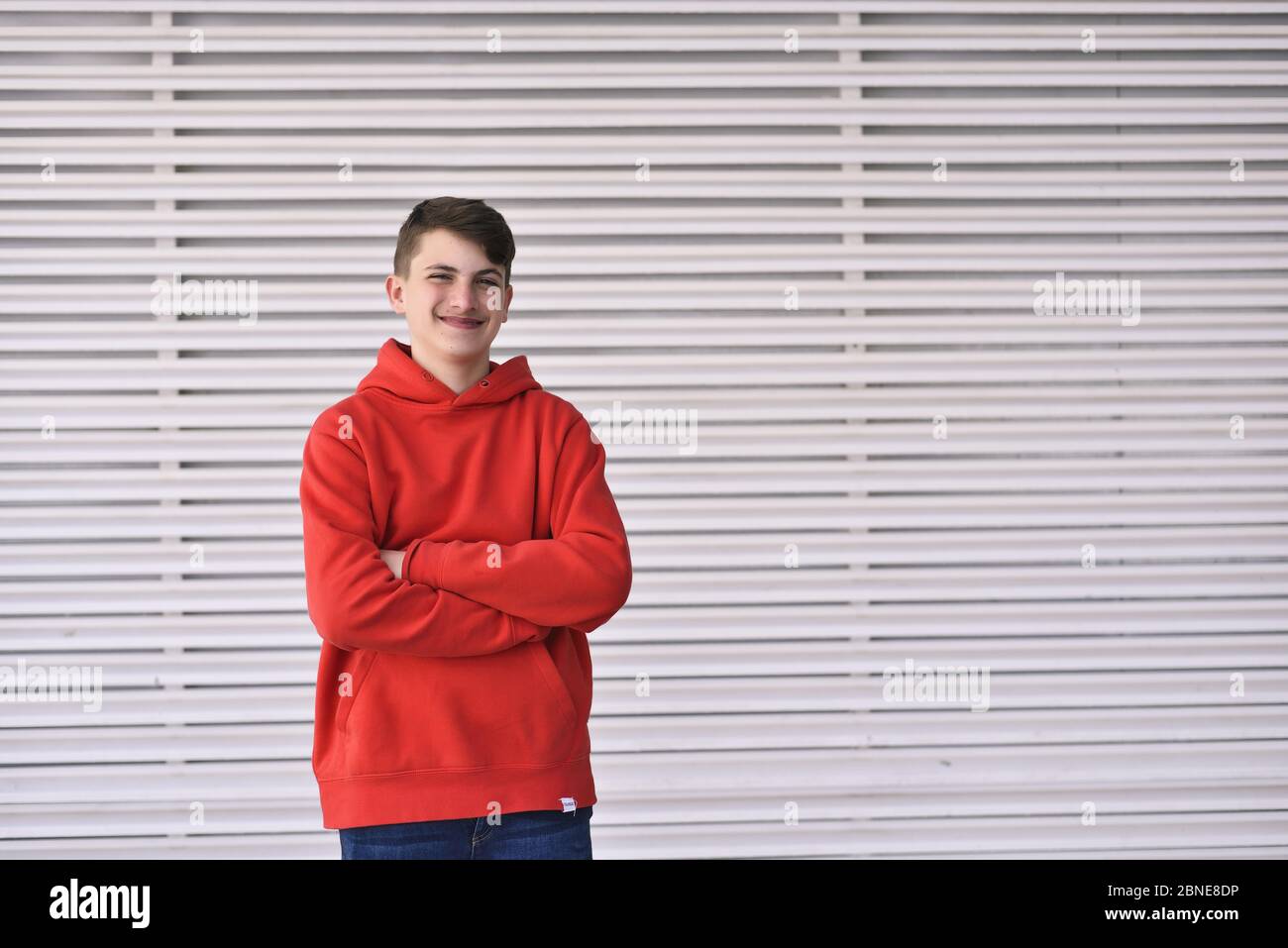 portrait of smiley teenager. dressing in a red shirt Stock Photo - Alamy