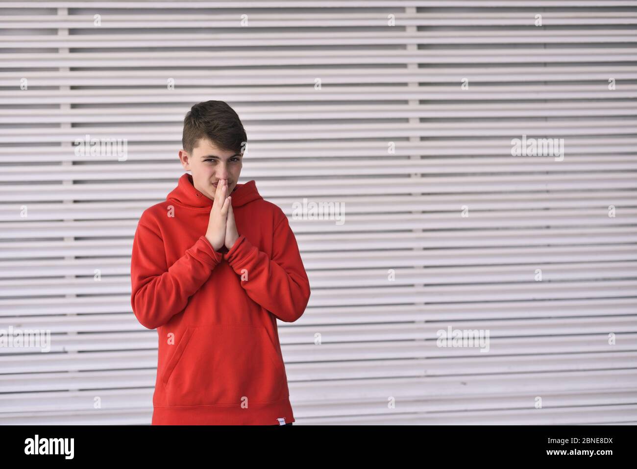 portrait of smiley teenager. dressing in a red shirt Stock Photo - Alamy