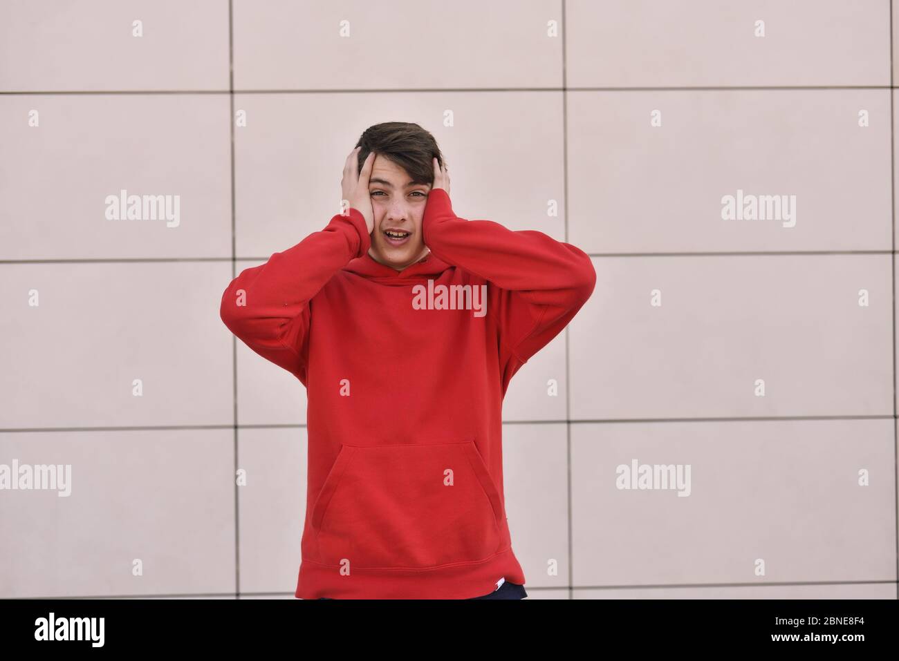portrait of smiley teenager. dressing in a red shirt Stock Photo - Alamy