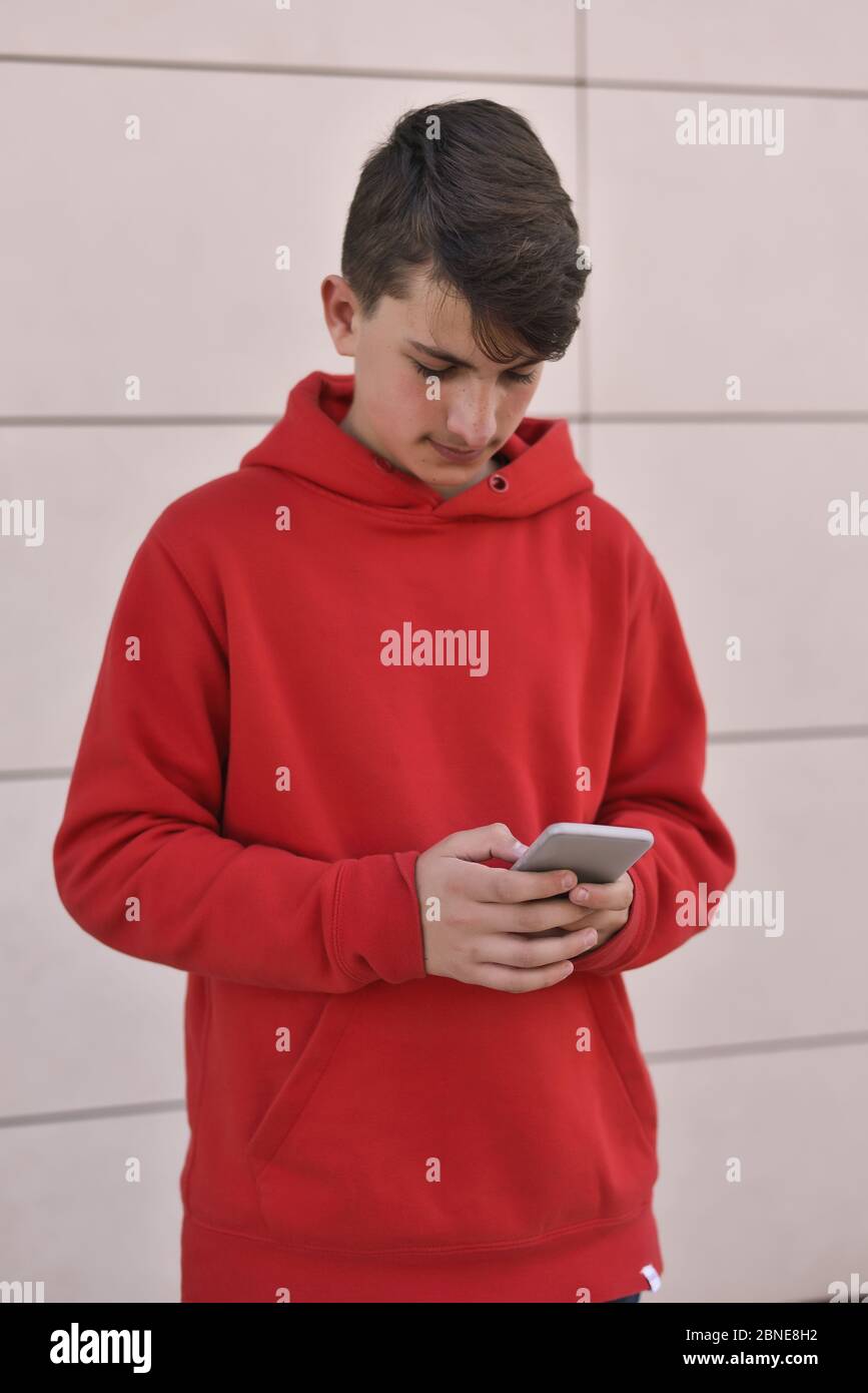 portrait of smiley teenager. dressing in a red shirt Stock Photo - Alamy