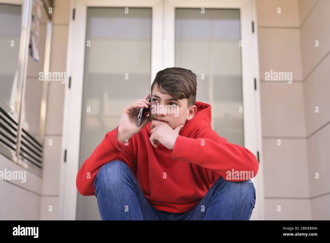 portrait of smiley teenager. dressing in a red shirt Stock Photo - Alamy