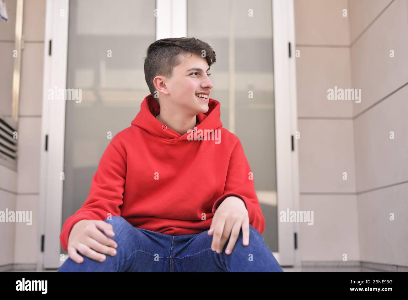 portrait of smiley teenager. dressing in a red shirt Stock Photo - Alamy