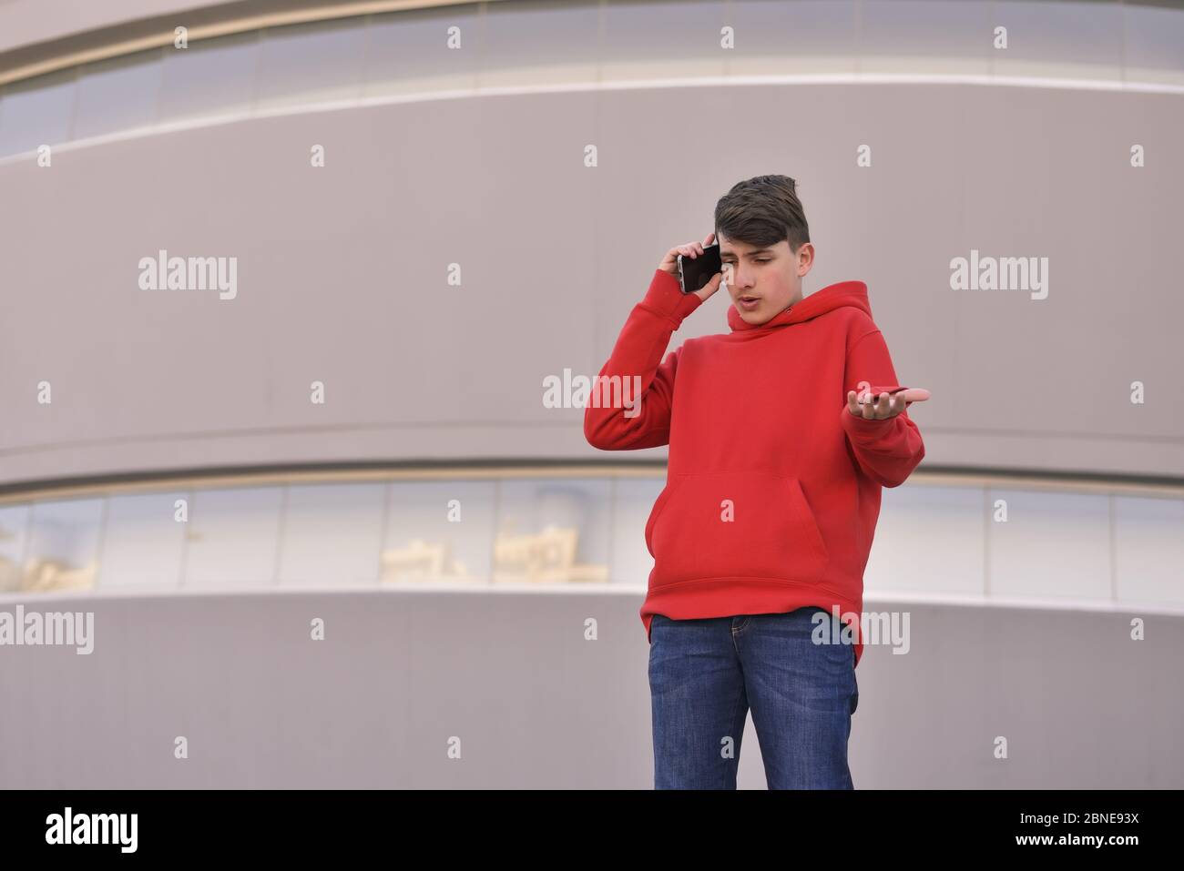 portrait of smiley teenager. dressing in a red shirt Stock Photo - Alamy