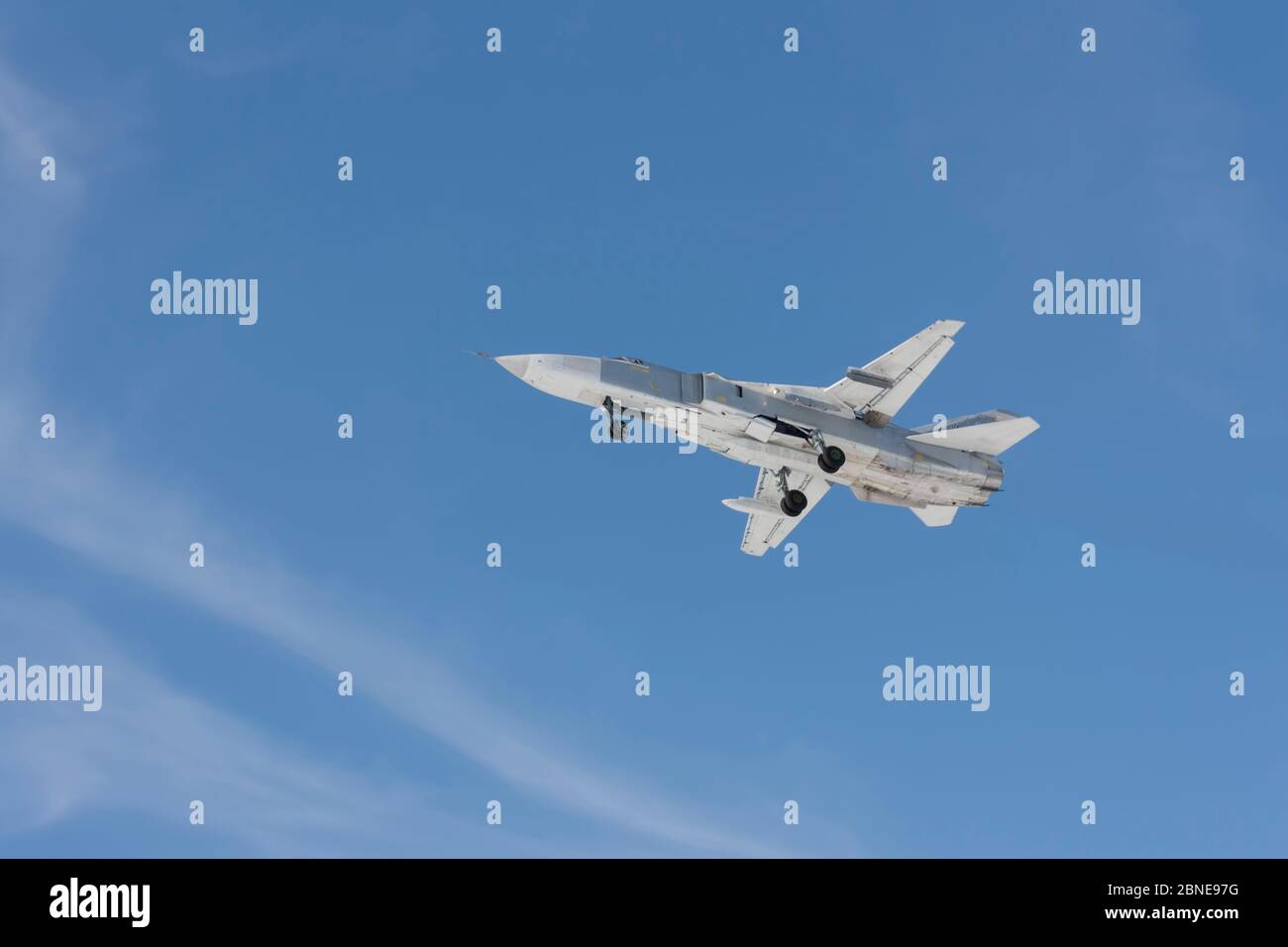 Military jet bomber Su-24 Fencer flying above ground Stock Photo - Alamy