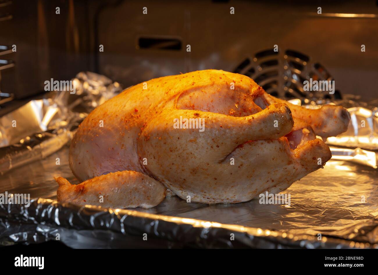 Cooking delicious of roasted chicken in the oven Stock Photo - Alamy
