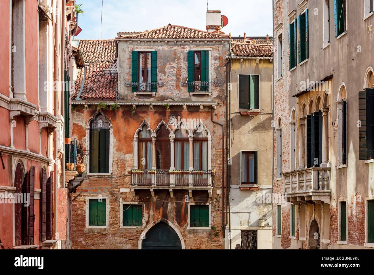 Tourist view of Venice. Channels with reflections. Street lights and ...