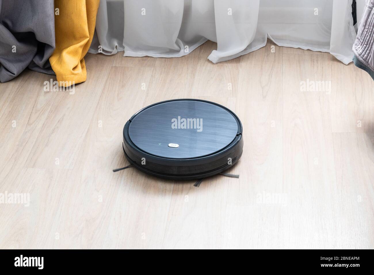 Modern technology concept. Technological cleaning of the room. Black ...