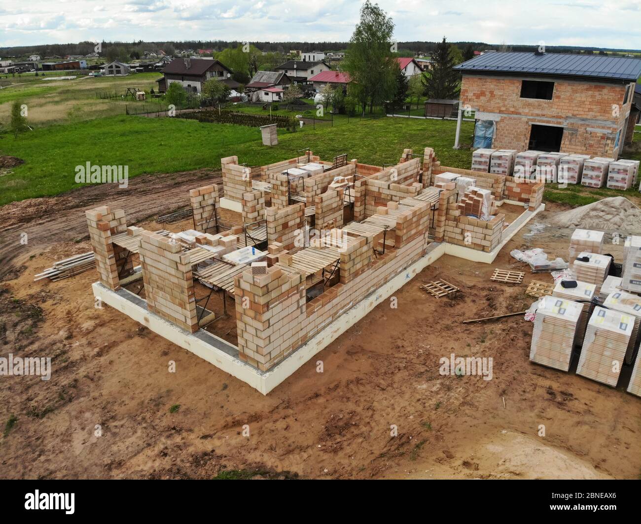 Brickwork in progress at the construction site. Ceramic block house ...