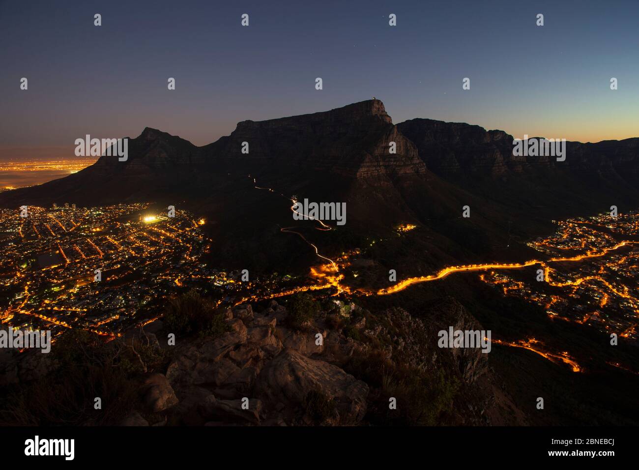 Table Mountain and the City of Cape Town, seen at night from Lions Head ...