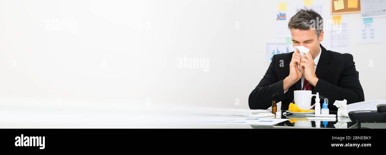 Office worker sneezing hi-res stock photography and images - Alamy
