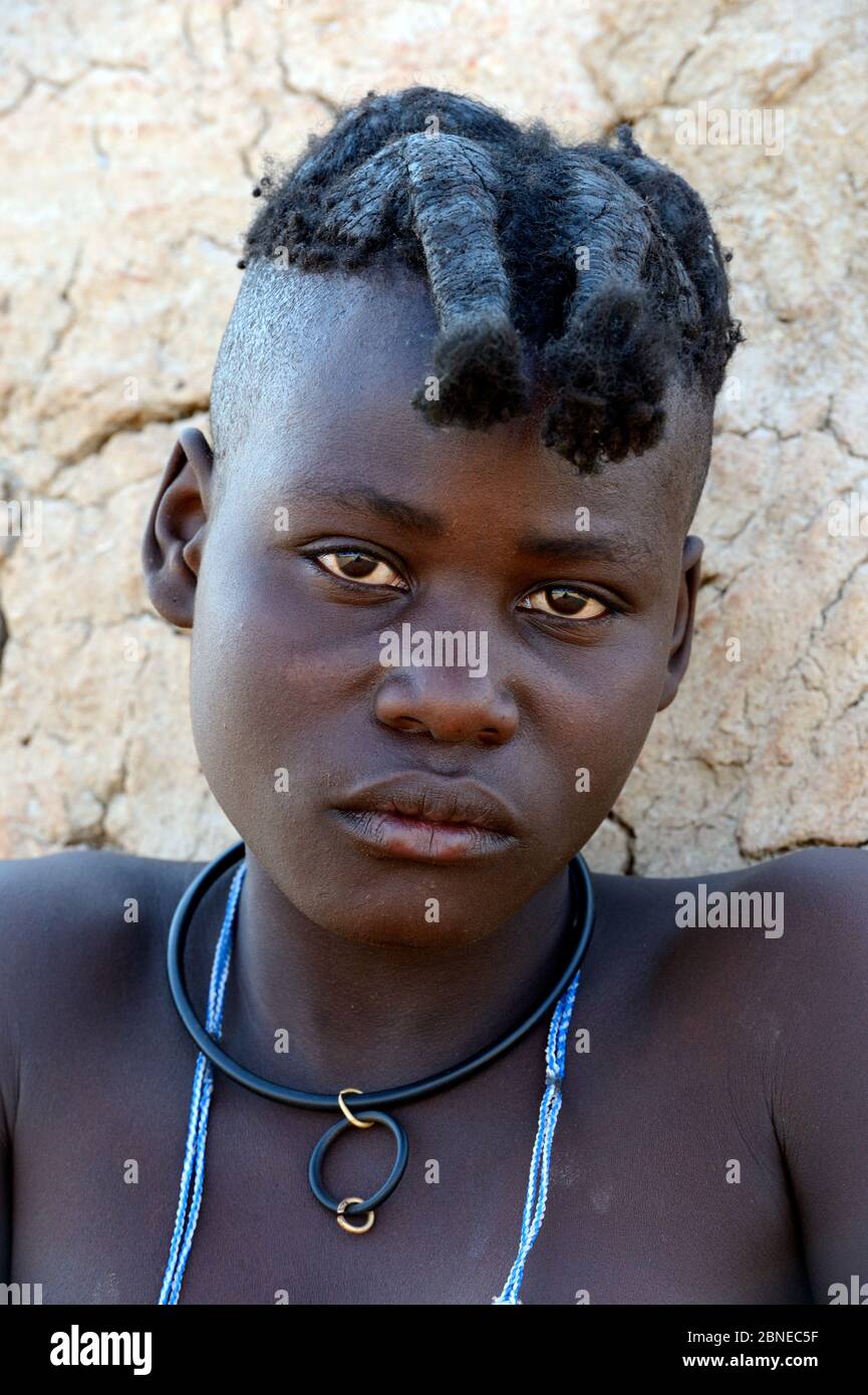 Portrait of Himba girl with the typical double plait hairstyle of the ...