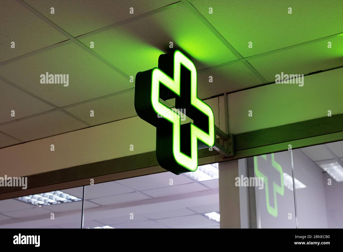 Bright green cross sign hi-res stock photography and images - Alamy