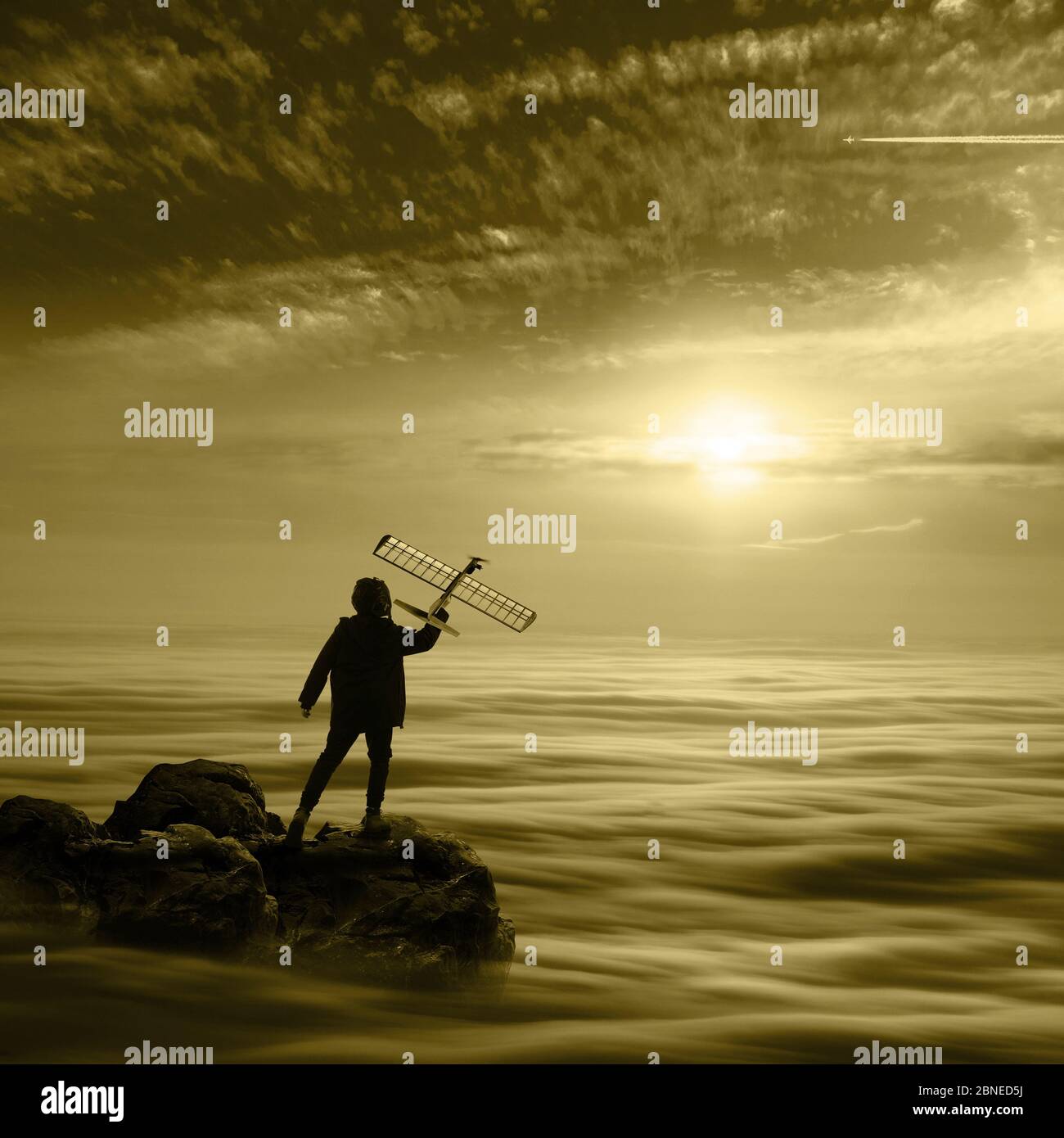 Boy teenager is standing on the stone above cloud layer. He is going to ...