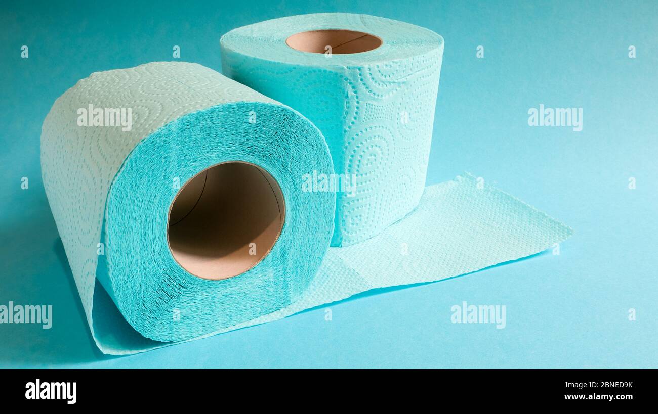 Blue roll of modern toilet paper on a blue background. A paper product ...