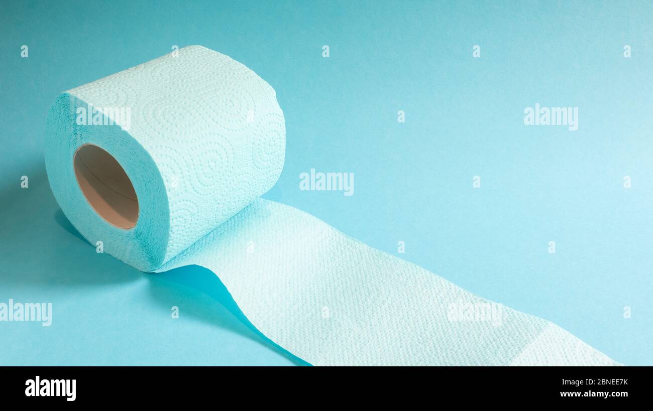 Blue roll of modern toilet paper on a blue background. A paper product ...